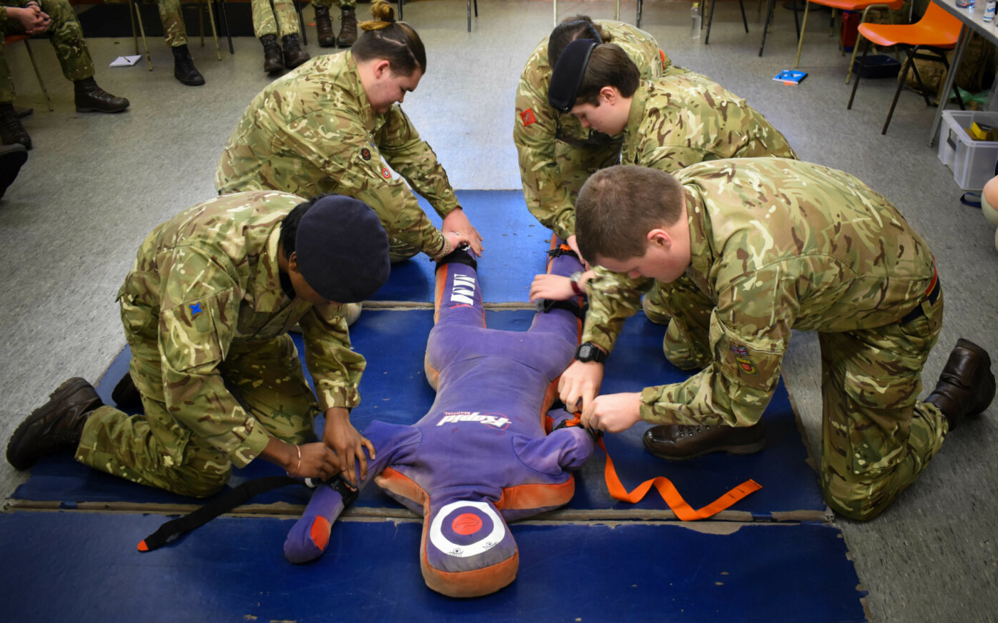 Cadets support a casualty in their first aid course lunch break